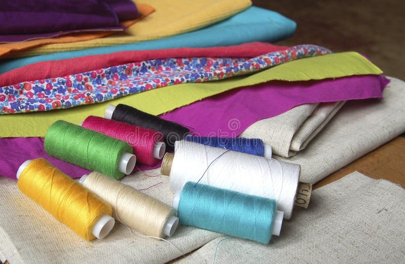 Background with Colored Fabrics and Sewing Threads Stock Photo - Image ...