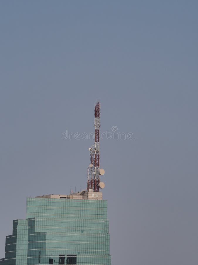 Background of Communication Towers on the Silver Building and the Sky ...