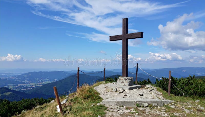 Background Containing a Big Cross Standing on the Top of a Mountain ...