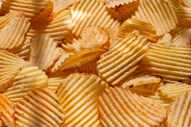 Background Corrugated Golden Chips with Texture. Selective Focus ...