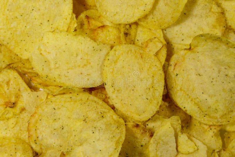 Background of Crispy Golden Chips with Ribbed Texture, Seasoned, with ...