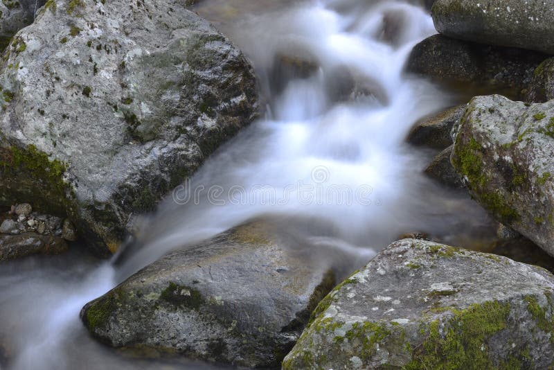 Background of Crystal Clear Water Running between the Stones Stock ...