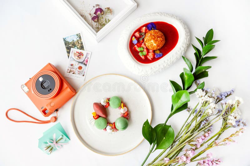 Background with Desserts, Polaroid Camera and Flowers. Top View on ...