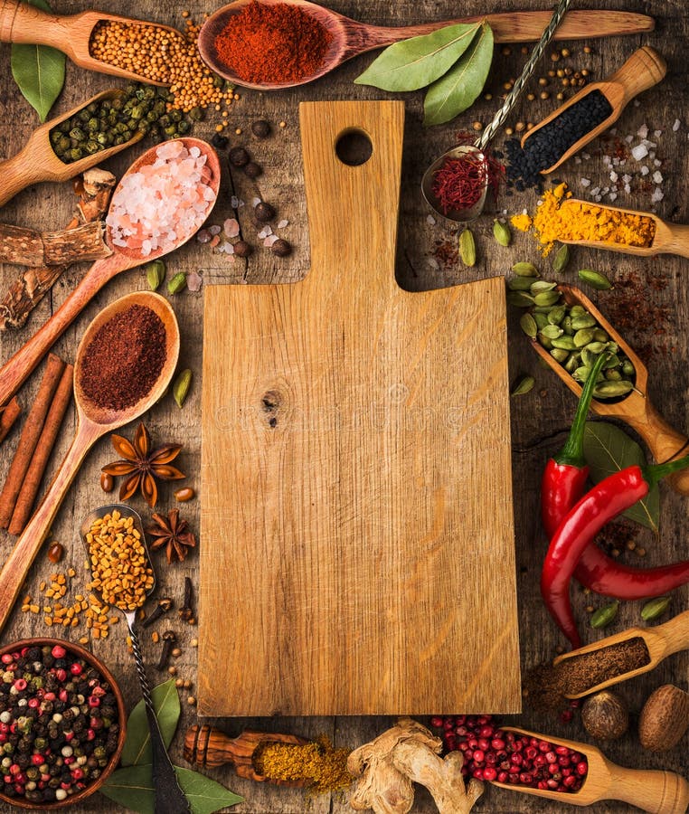 Background with Different Spices Around the Cutting Board Stock Image ...