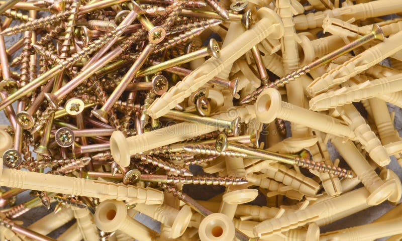 Background with Dowel Nails. Group of Nail-plugs with Plastic Nails ...