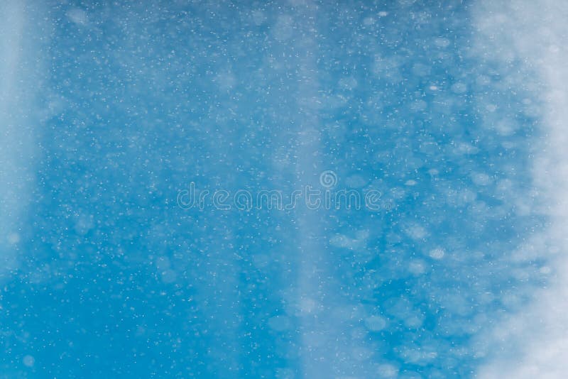 Background from Falling Blurry Snow Against Blue Sky Stock Photo ...