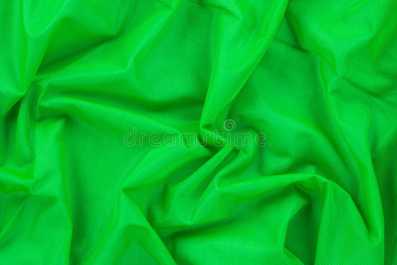 Background in the Form of Material from Bright Green Nylon with Folds ...