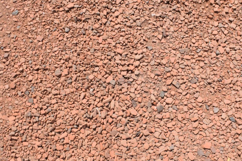 Road of small red stones stock image. Image of pattern - 114578921
