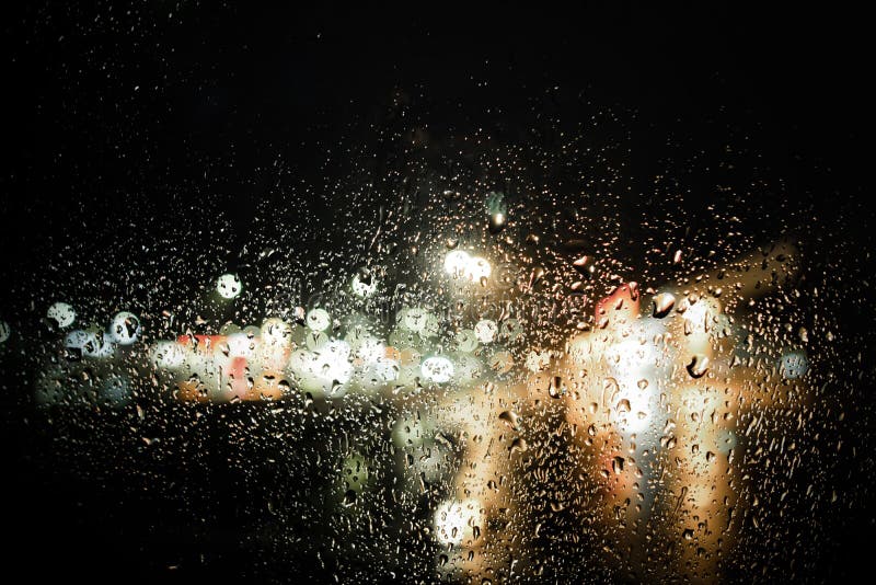 Background of Glowing Lights through Raindrops Stock Photo - Image of ...