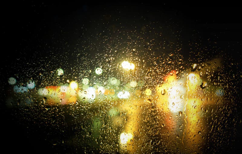 Background of Glowing Lights through Raindrops Stock Image - Image of ...