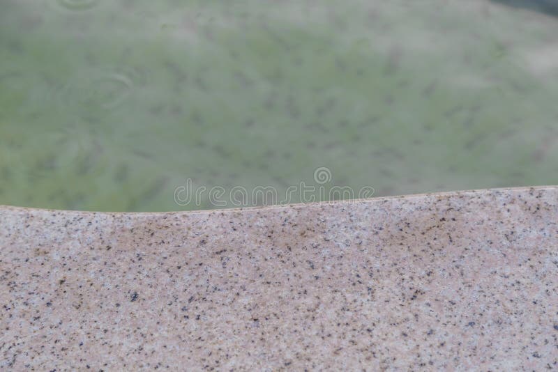 Background of Granite and Water in the Background. Stock Image - Image ...