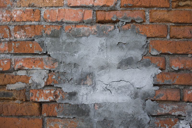 Background of Grunge Red Brick Wall with Concrete Patch . Close Up View ...