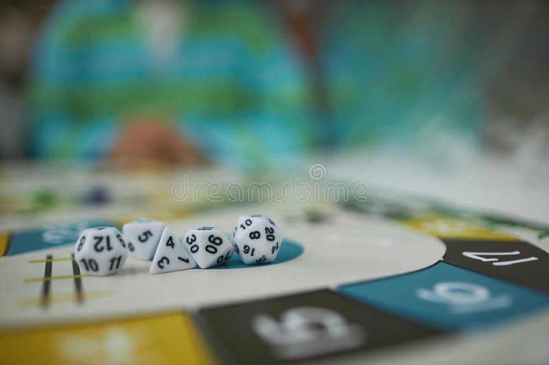 Background Image of Board Game with Macro Closeup of Multi Sided Dice ...