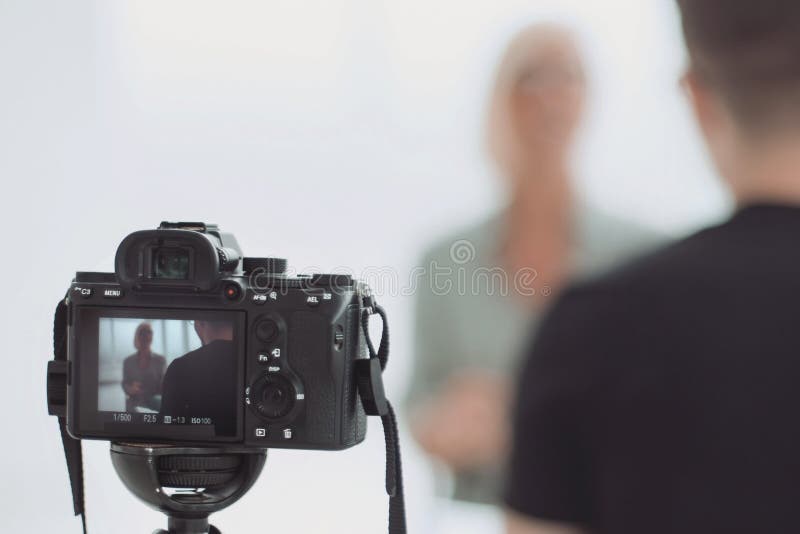 Background Image is a Camera Filming an Interview in Studio Stock Photo ...