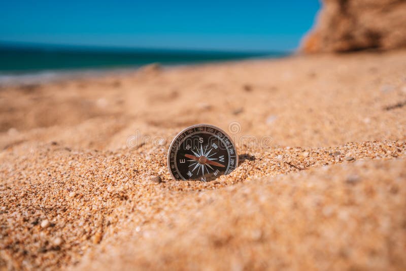Background Image of Compass Lying on Beach with Sea View, Travel ...
