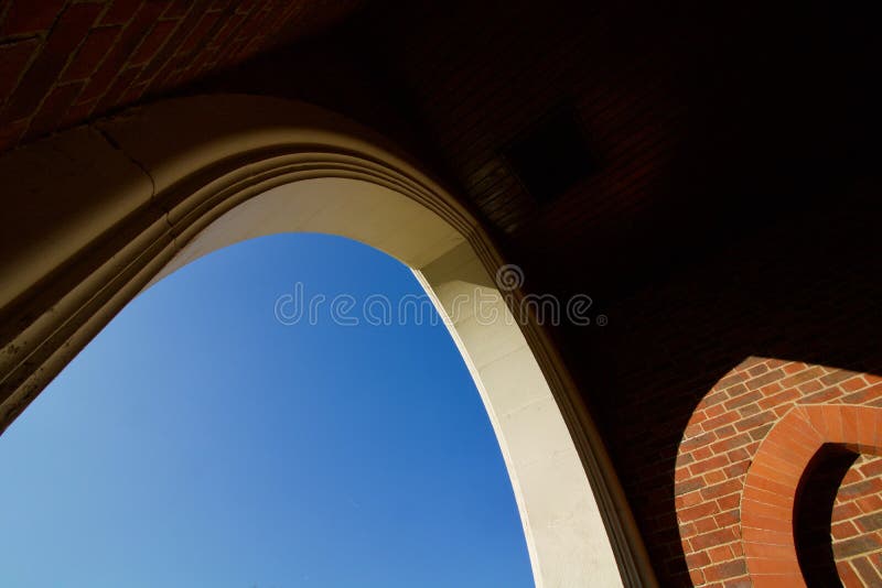 Sky Visible through White Arch beside Brickwork - Image Stock Photo ...