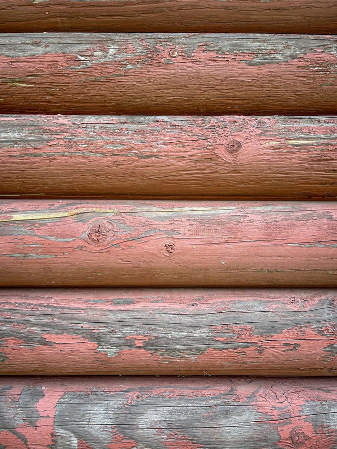 A Background Image of Distressed Cabin Logs Painted Red and Weathered ...