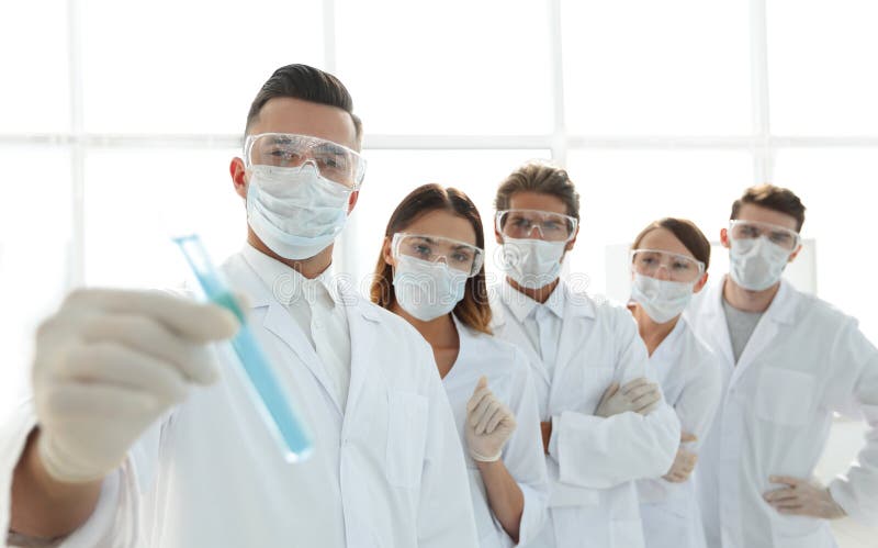 Background Image is a Group of Medical Workers Working with Liquids in ...