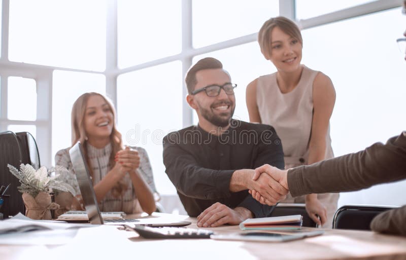 Background Image of the Handshake of Business Partners in the Office ...
