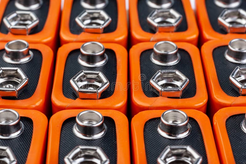 Background Image of a Large Number of Orange Batteries, Standing in ...