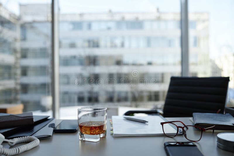 Office Space with Whiskey Glass on Table Against Big Windows Stock ...