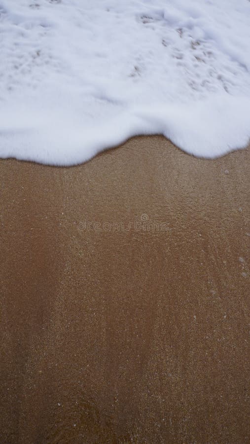 Background Image Pattern of Sea Shore with Sea Waves on Sand Stock ...