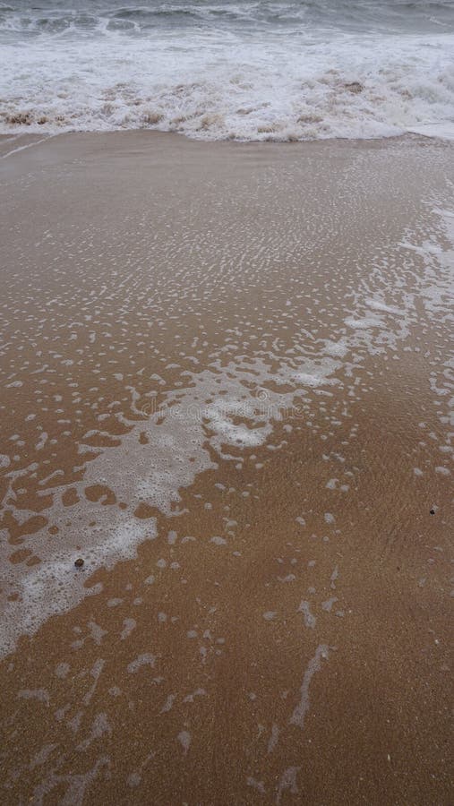 Background Image Pattern of Sea Shore with Sea Waves on Sand Stock ...