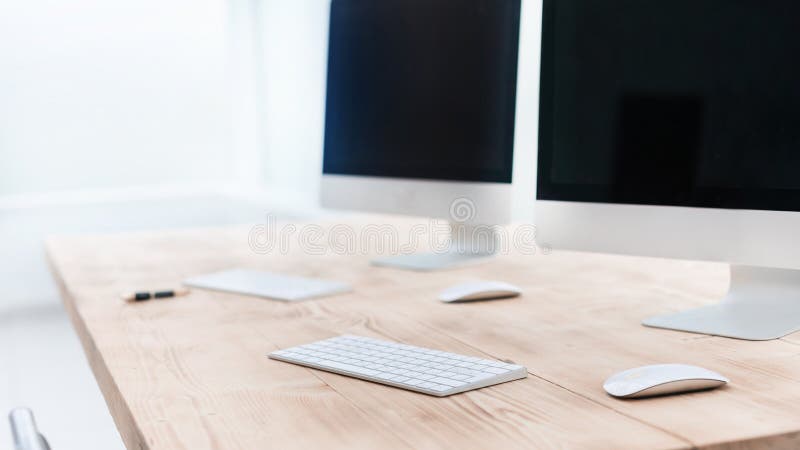 Background Image of Personal Computers on the Office Desk Stock Photo ...