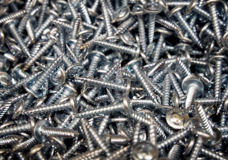 Background Image of Small Screws in Bulk Stock Photo - Image of metal ...