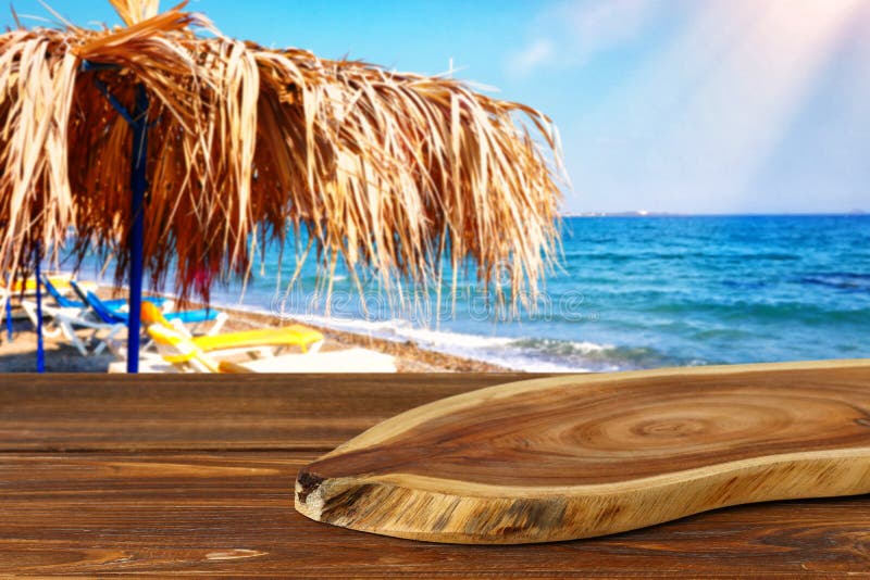 Background Image of Wooden Table in Front of Tropical Beach. Ready for ...
