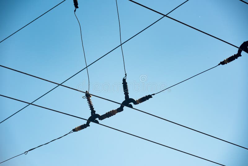 Intersecting Wires with Section Insulator Against a Blue Sky Stock ...