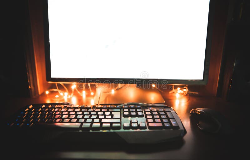 Background. Keyboard, Mouse and Computer Monitor at Night with Warm ...