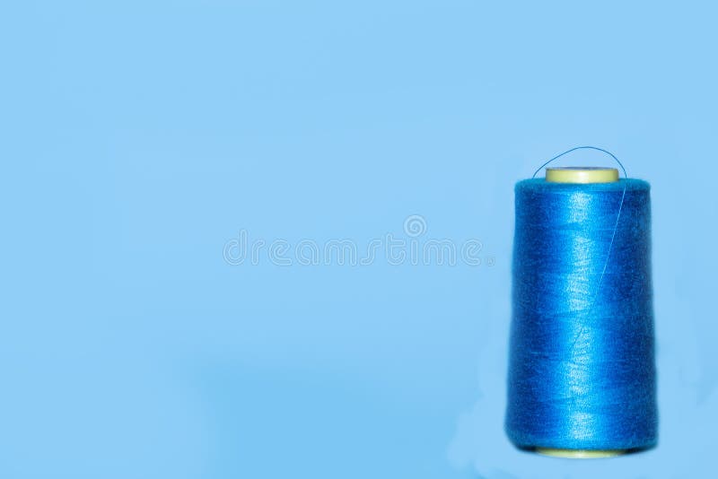 Background with a Large and Small Blue Spool of Thread. they Lie Next ...
