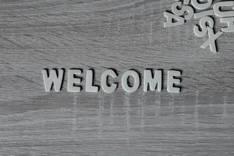 Background. Letters on Wooden Table. `Welcome` Stock Photo - Image of ...
