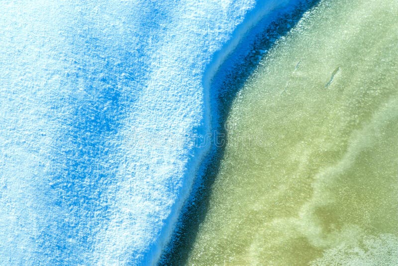 Background with a Line of Contact of Ice and Snow in the Rays of the ...