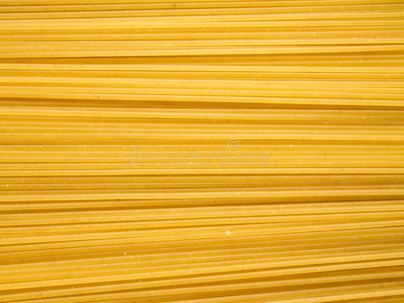 Background of Long Raw Yellow Spaghetti Pasta in Horizontal Plane Stock ...
