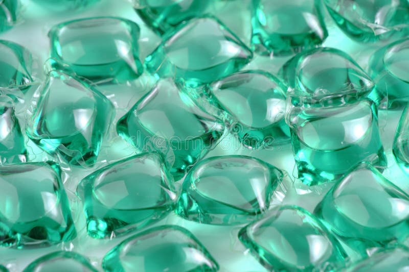 Background Lot of Capsules for Washing Green on Light Background. Stock ...