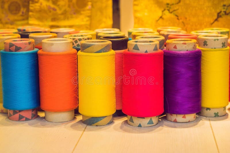 Background with a Lot of Colorful Coils with Threads. Bobbins are ...