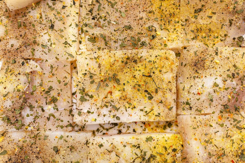 Background Made of Cod Fish Fillet Cut into Squares and Sprinkled with ...