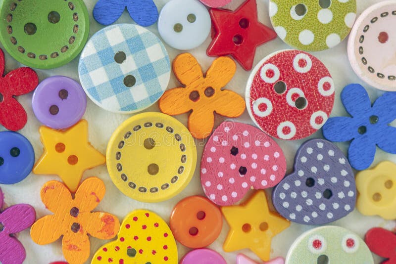 The Background is Made Up of Multicolored Buttons of Different Sizes ...