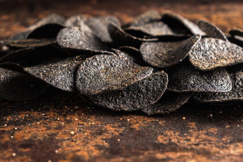 Background of Many Black Chips with Spices Stock Image - Image of food ...