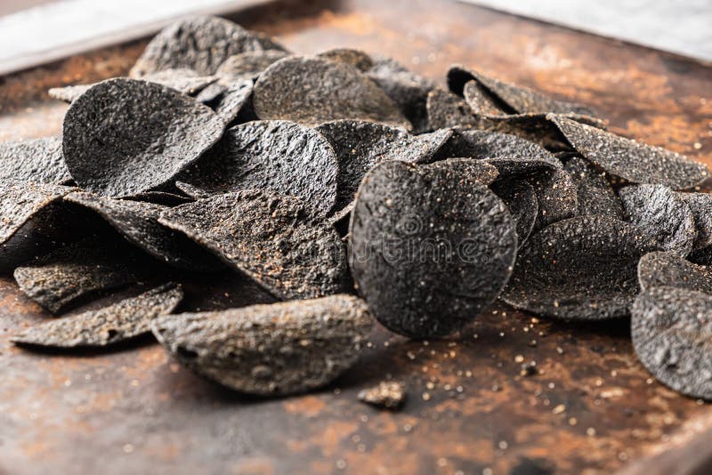 Background of Many Black Chips with Spices Stock Image - Image of macro ...