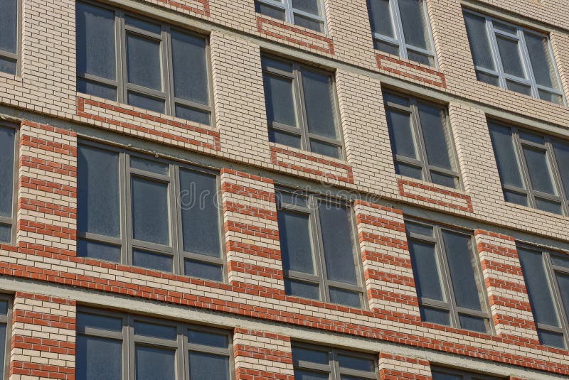 Texture of Gray Windows on a Brown Brick Wall Stock Photo - Image of ...