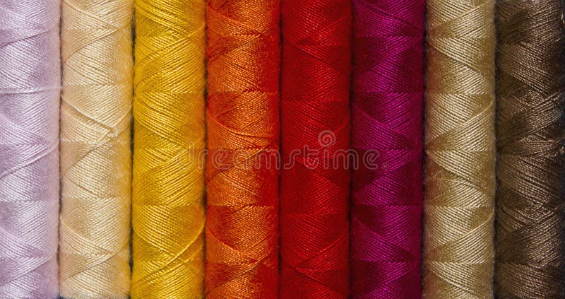 Multi-colored Spools of Thread Stock Photo - Image of beige, sewing ...