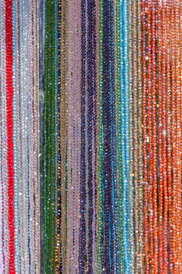 Background of Multicolored Bead Strands Arranged in Vertical Rows ...