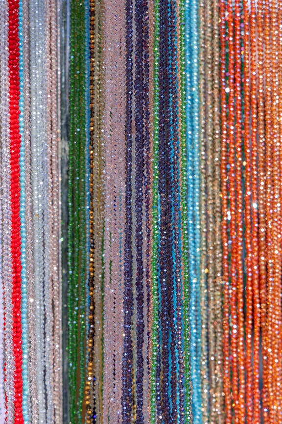Background of Multicolored Bead Strands Arranged in Vertical Rows ...