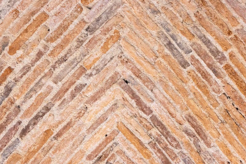 Background of Old Bricks Laid in a Herringbone Pattern Stock Photo ...