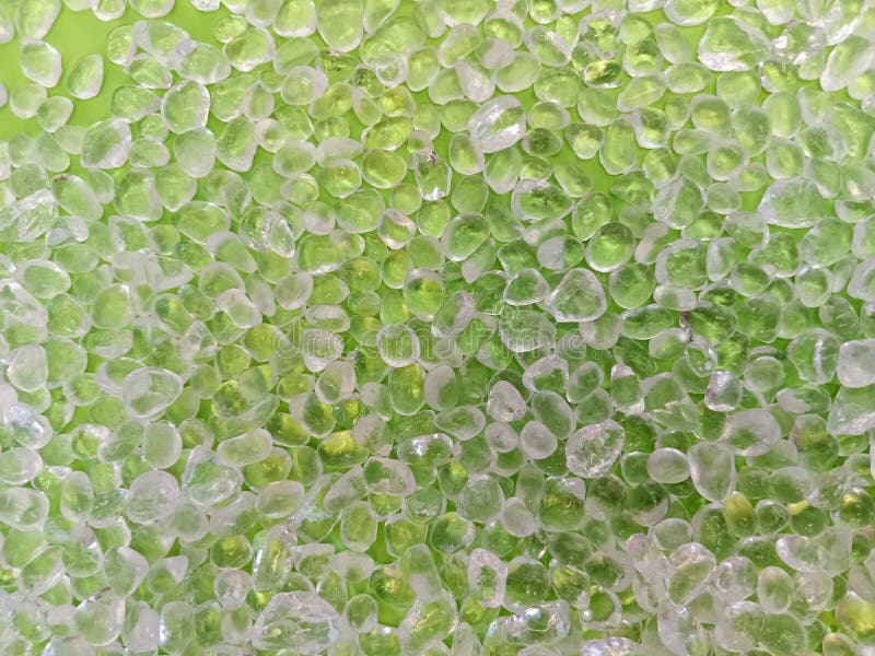 Background of Polished Quartz Stones and Rocks on a Green Background As ...