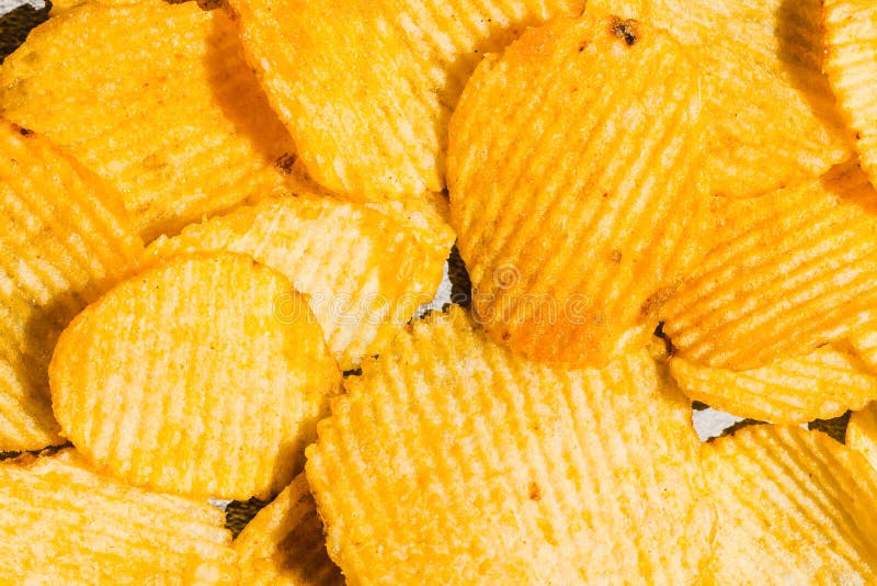 Background of Potato Crisps Close-up. the Texture of the Corrugated ...