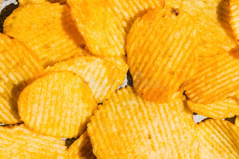 Background of Potato Crisps Close-up. the Texture of the Corrugated ...
